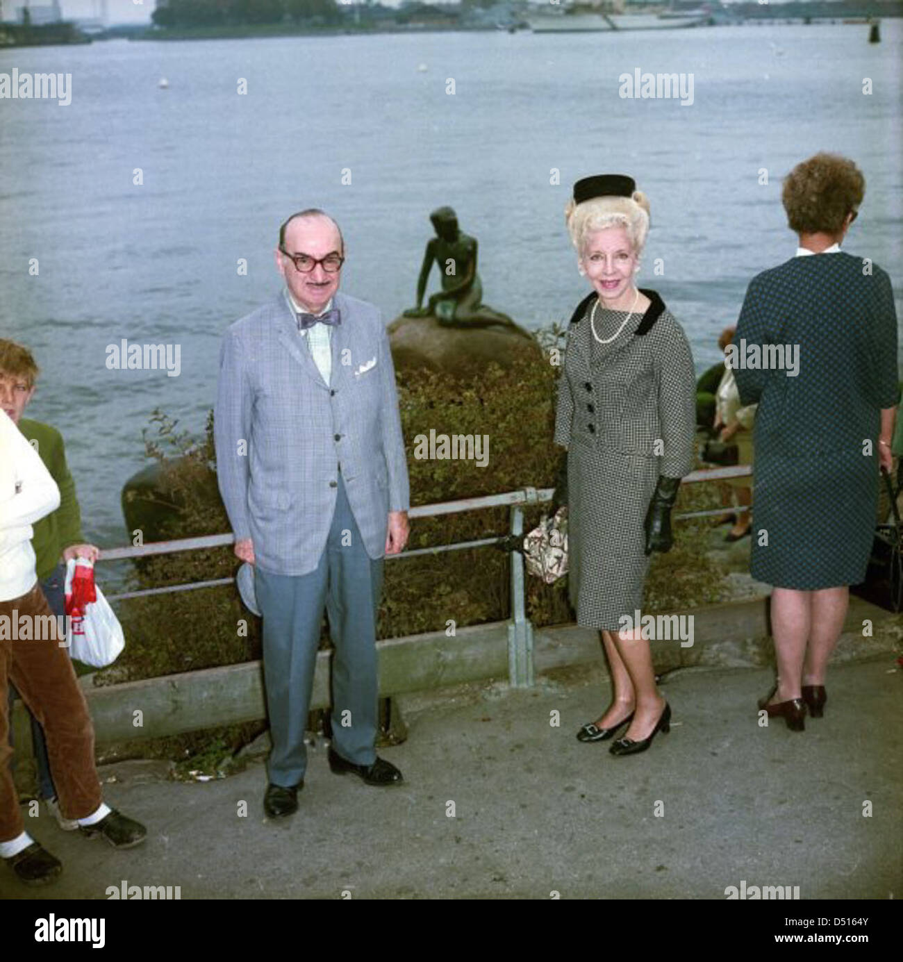 An unidentified couple poses in front of the Little Mermaid sculpture ...