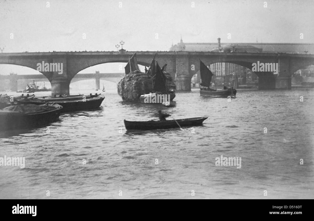 This image depicts a hay barge near London Bridge on the River Thames ...