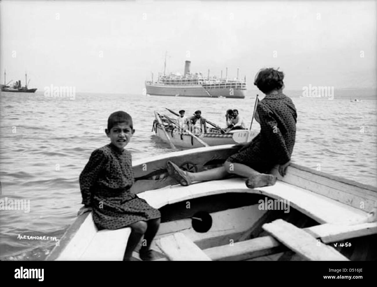 Two children on a rowing boat hi-res stock photography and images - Alamy