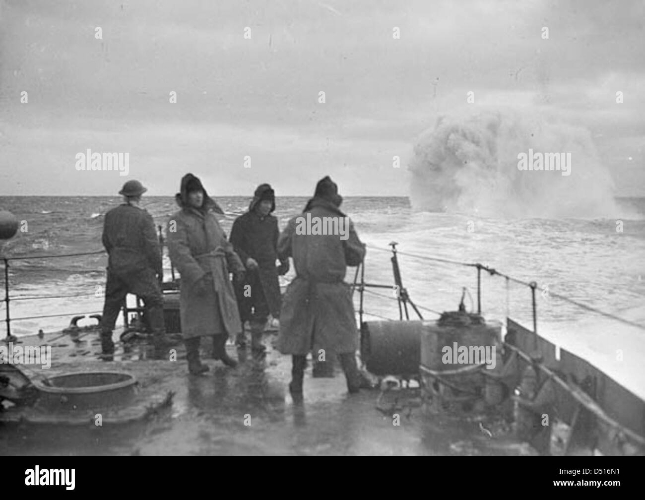 This image shows a V/W-class destroyer dropping a depth charge during ...