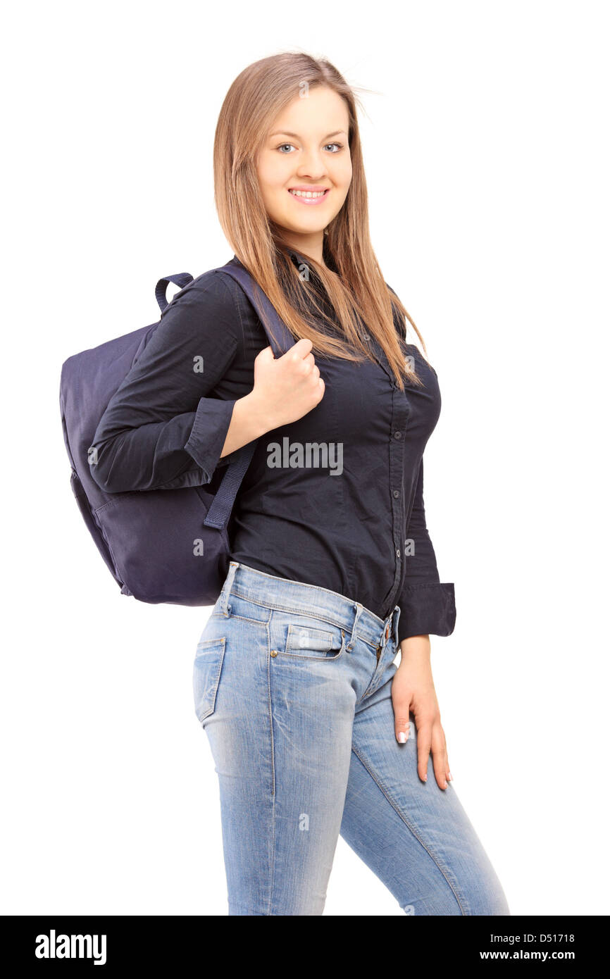 A smiling female student with a backpack isolated on white background ...