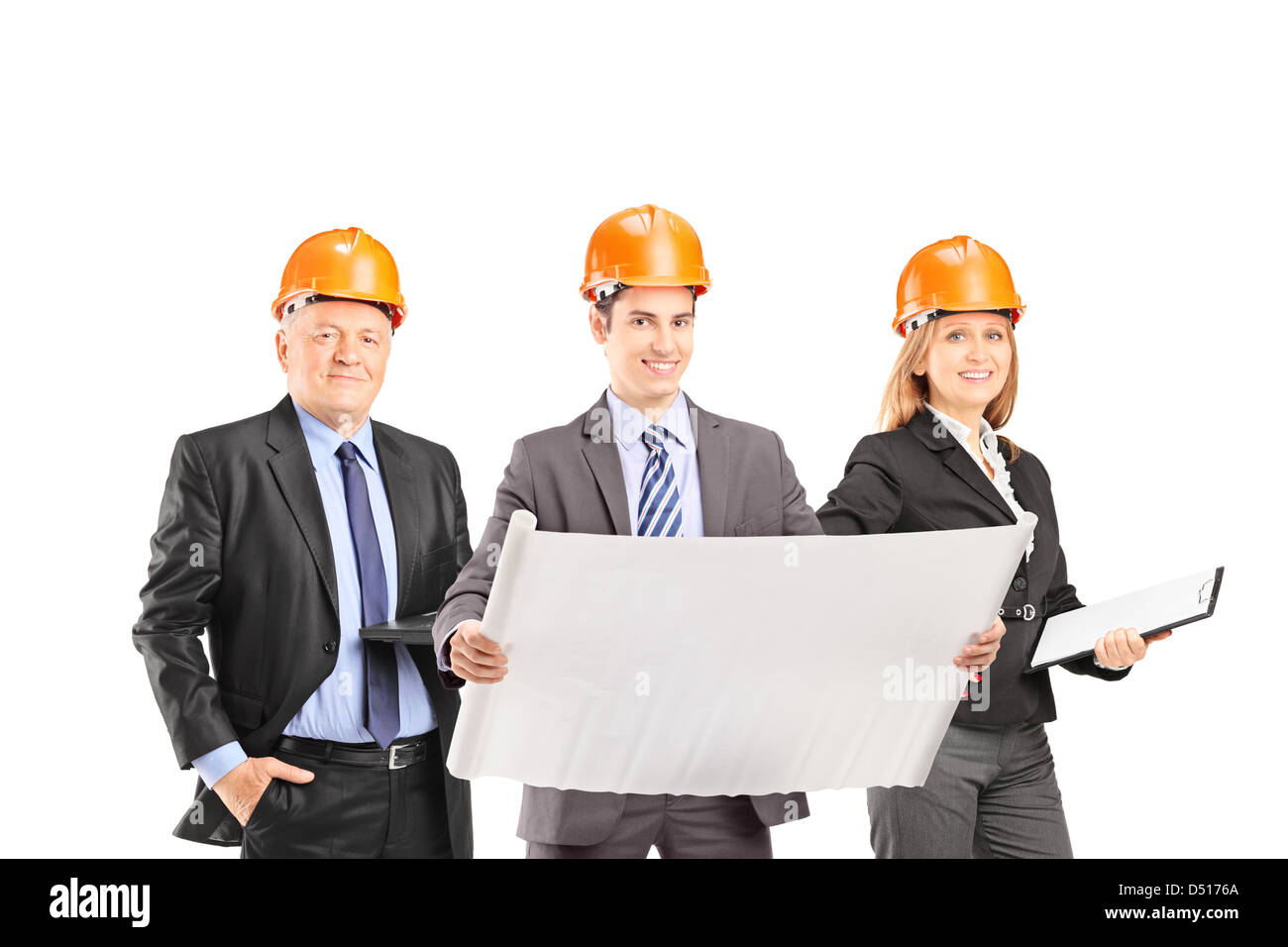 Team of successful engineers with helmets isolated on white background ...