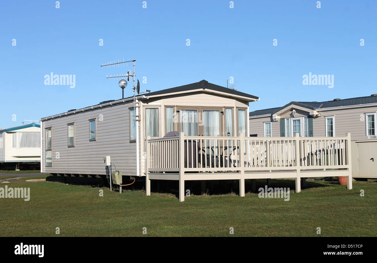 Modern static caravans in park with blue sky background Stock Photo - Alamy