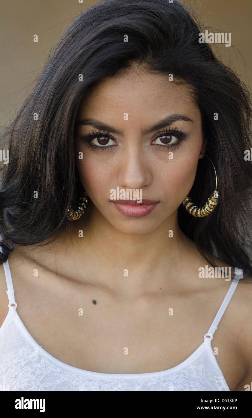 Beautiful young exotic woman with long dark hair Stock Photo - Alamy