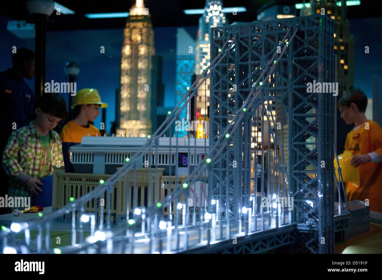 Yonkers, New York, U.S. March 21, 2013. Children look over the LEGO ...