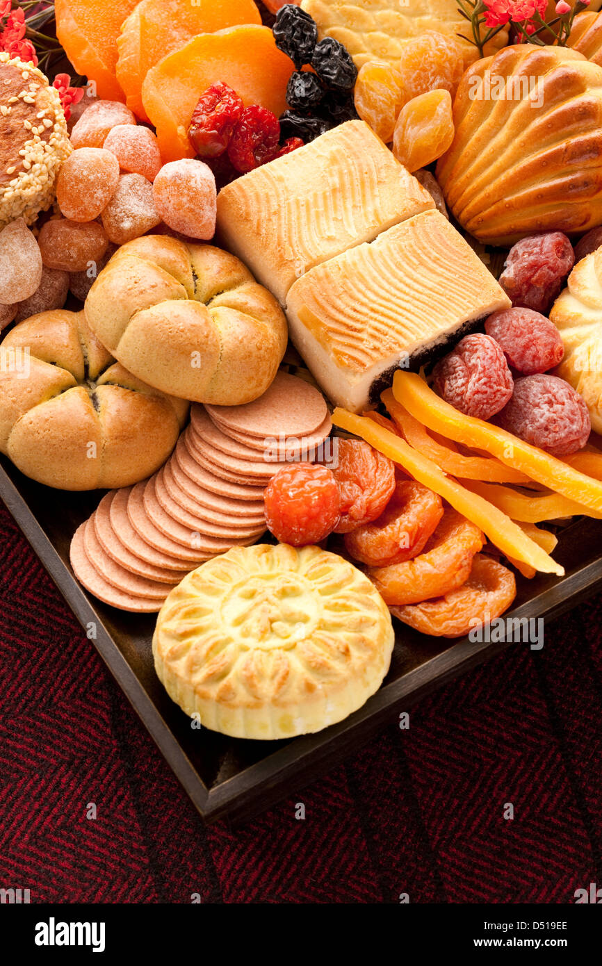 Various Chinese traditional dim sum and preserved fruits Stock Photo ...