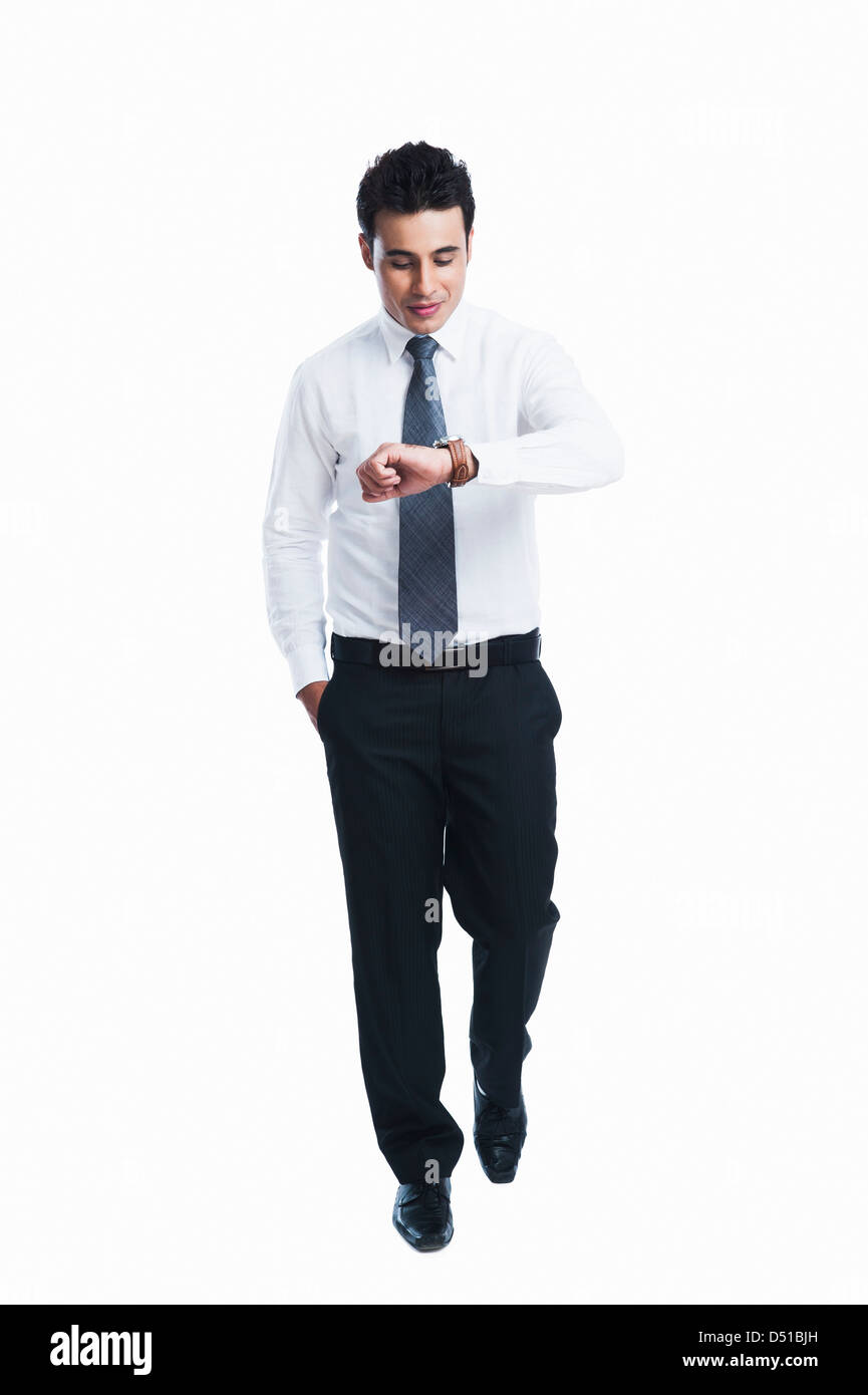 Businessman checking the time Stock Photo - Alamy