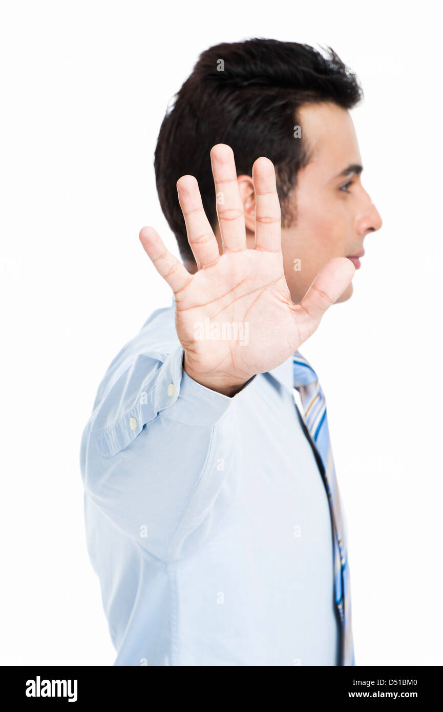 Businessman showing a stop gesture Stock Photo - Alamy