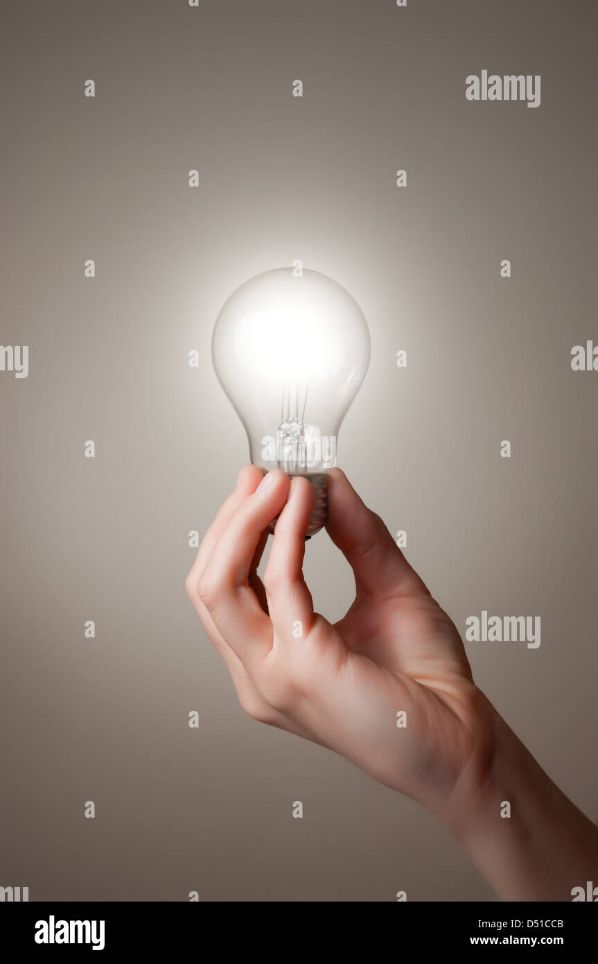 Bio Energy - Hand with light bulb Stock Photo - Alamy
