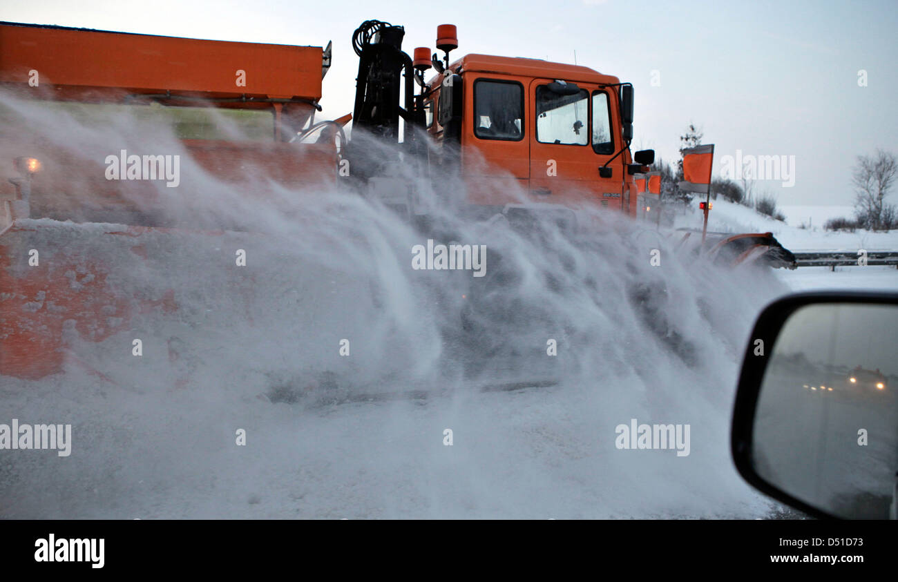 Two snow-clearing vehicles of the winter road clearance drive along the ...