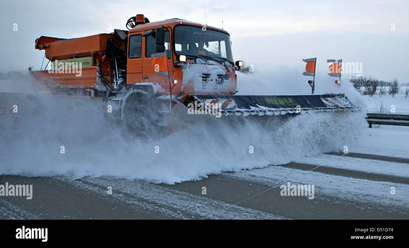 Two snow-clearing vehicles of the winter road clearance drive along the ...