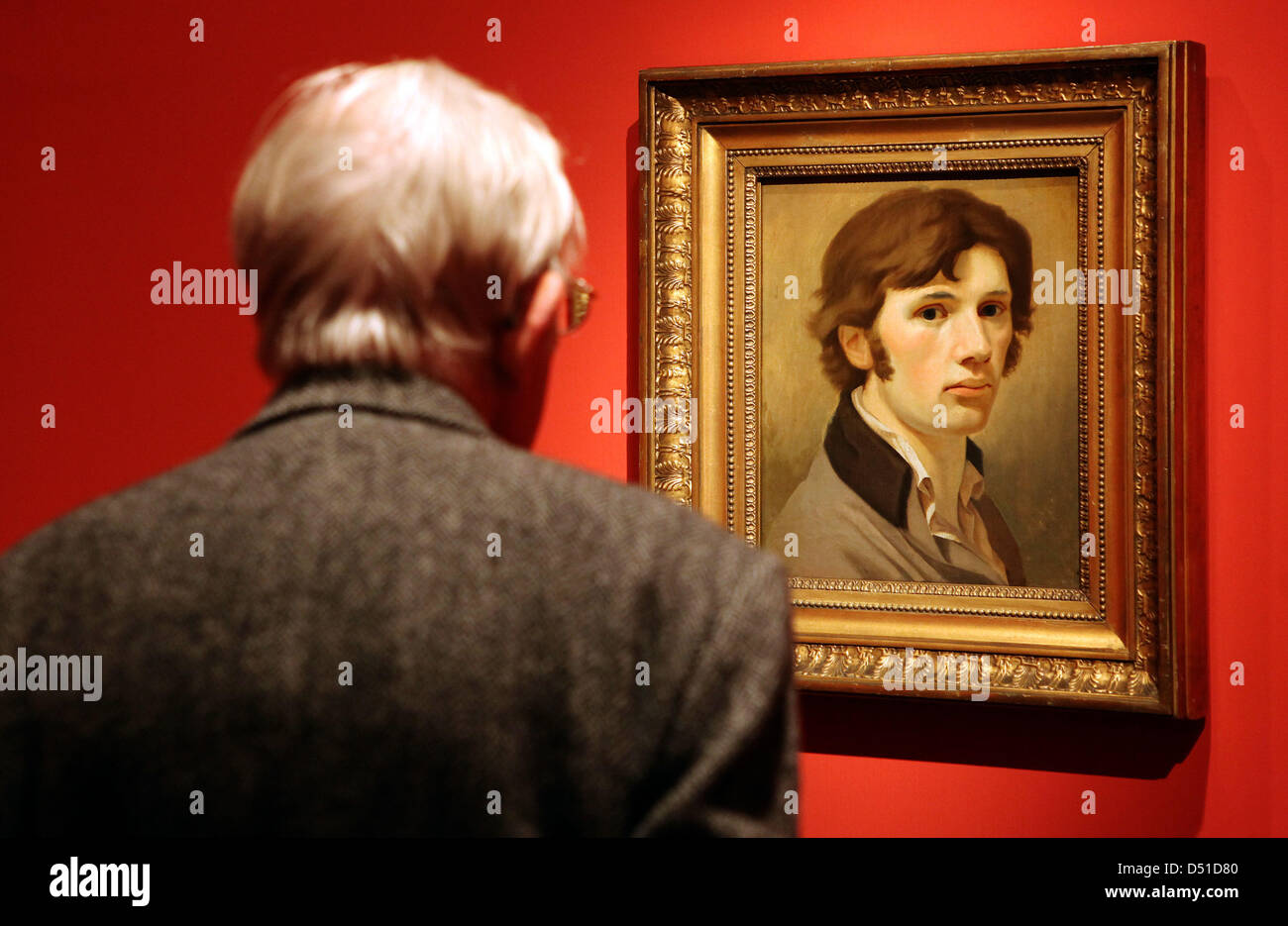 A visitor looks at the self-portrait of German painter Philipp Otto ...