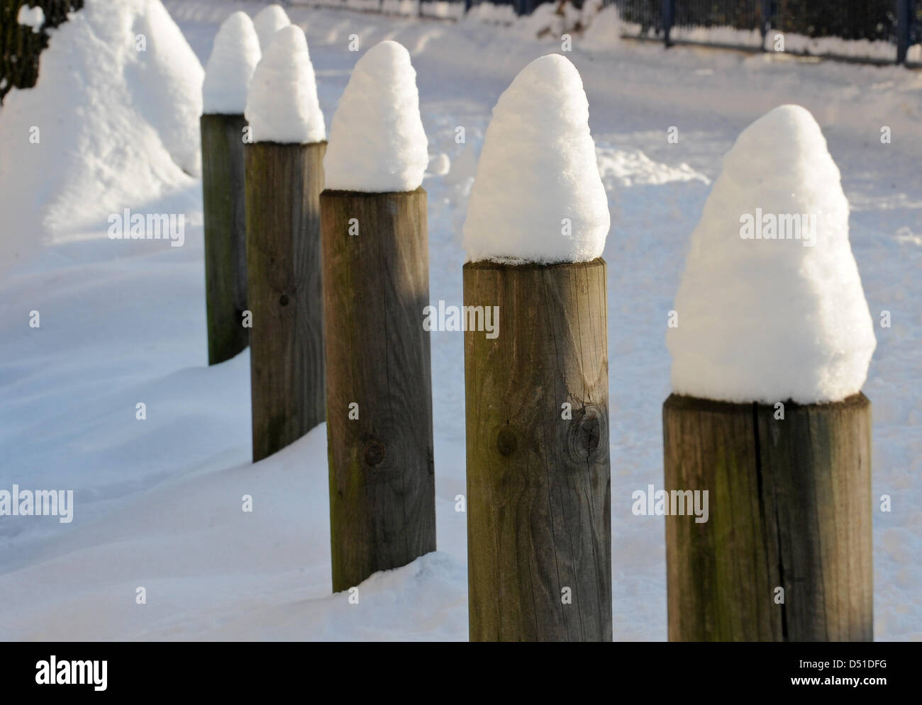 Snow has collected on poles in Dresden, Germany, 02 December 2010 ...