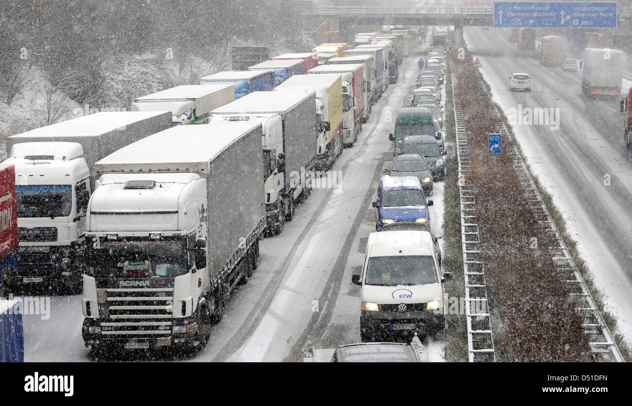 Vehicles line up in a traffic jam in the snow on Autobahn 2 near ...