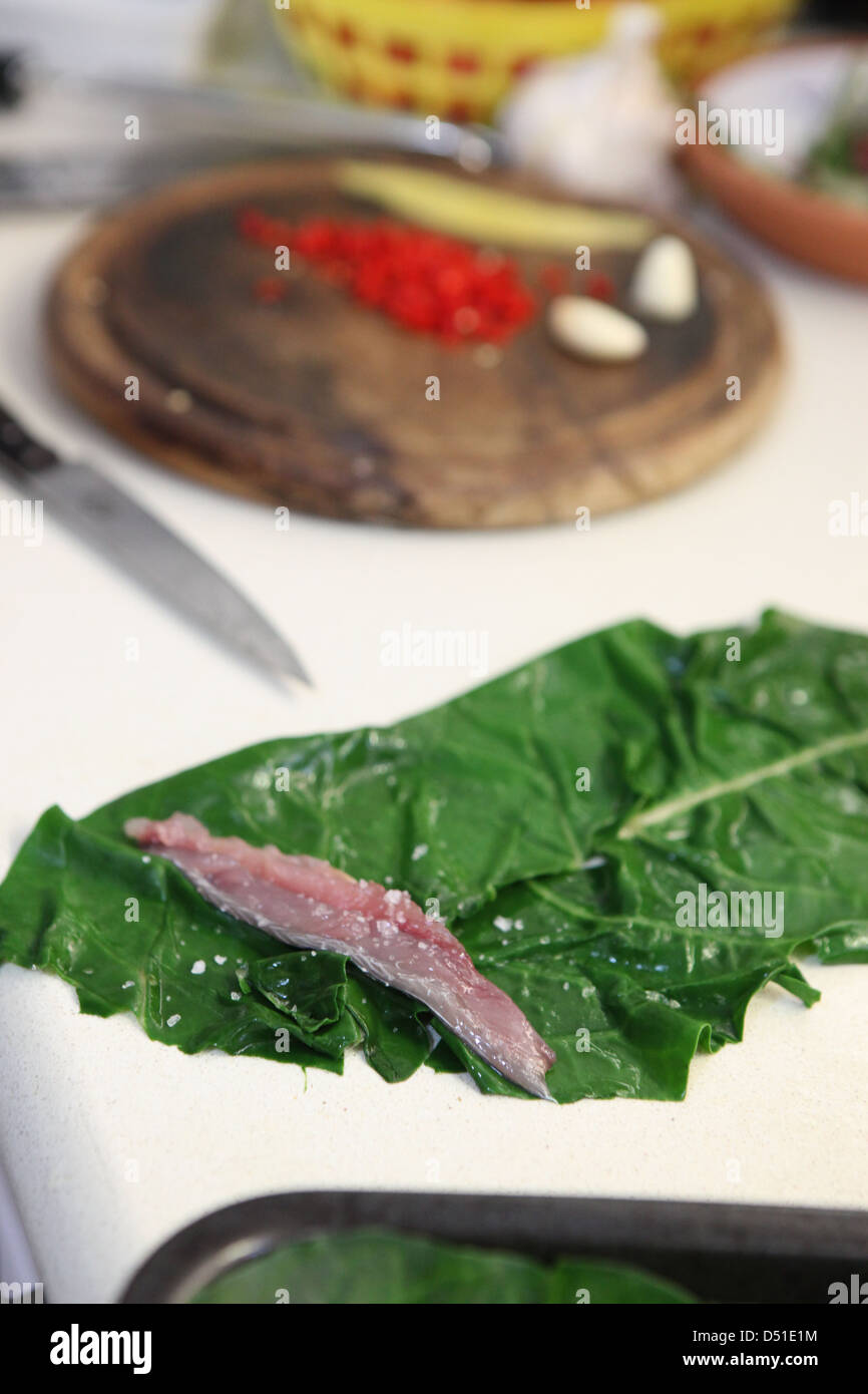 Mackerel fish fillet wrapped in chard leaves Stock Photo - Alamy