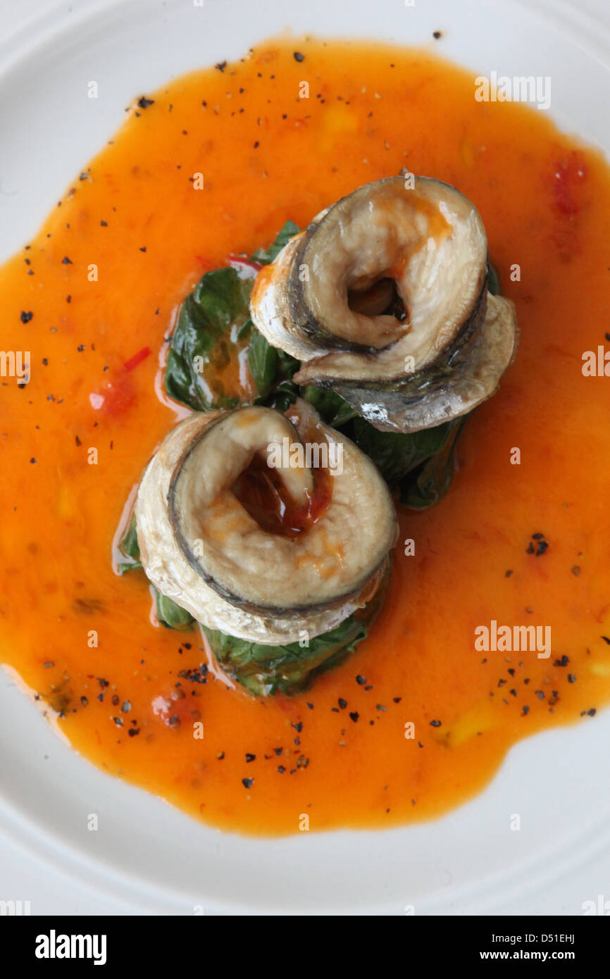 Chard leaf balls with fish fillet Stock Photo - Alamy
