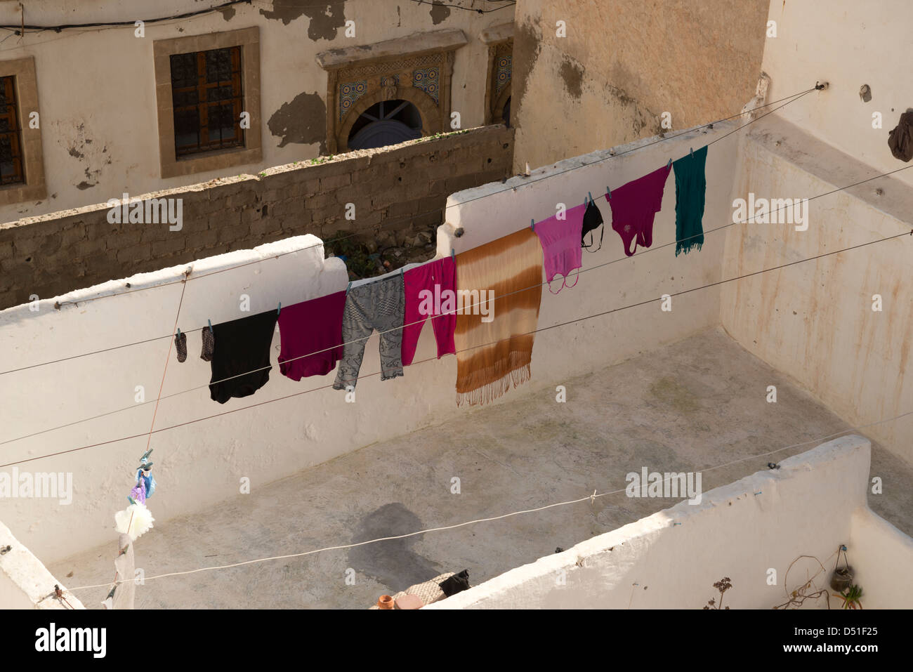 Hanging up clothes hi-res stock photography and images - Alamy