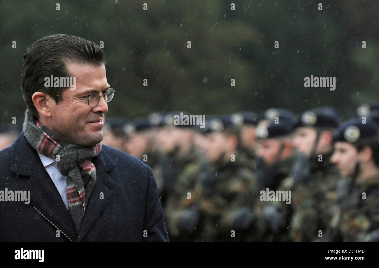 German Defence Minister Karl-Theodor zu Guttenberg walks past the ...