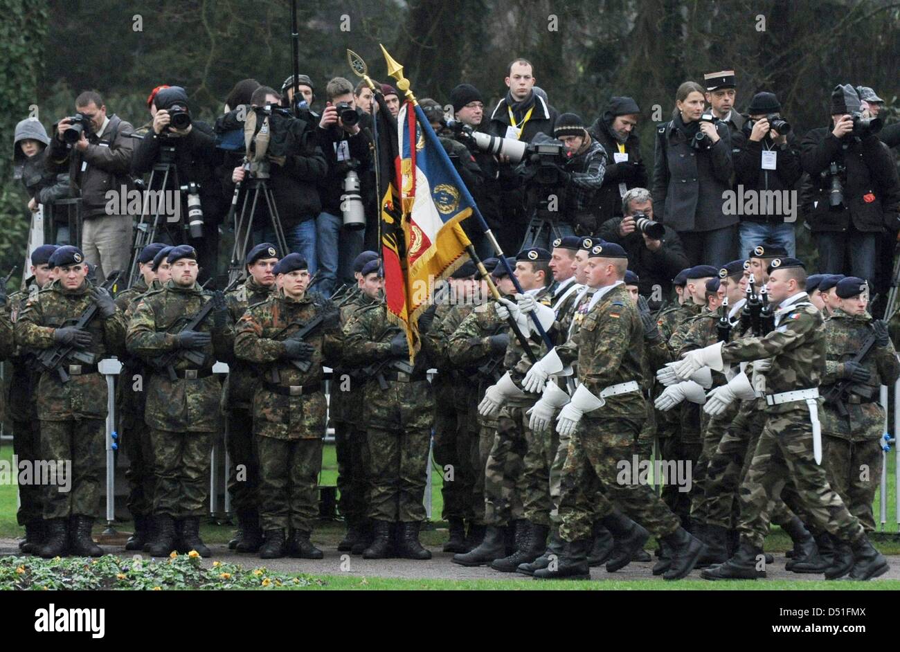 Photographers and cameramen have lined up behind the soldiers during a ...
