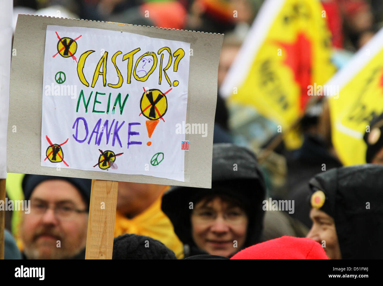 People hold handwritten signs and protest against nuclear waste ...