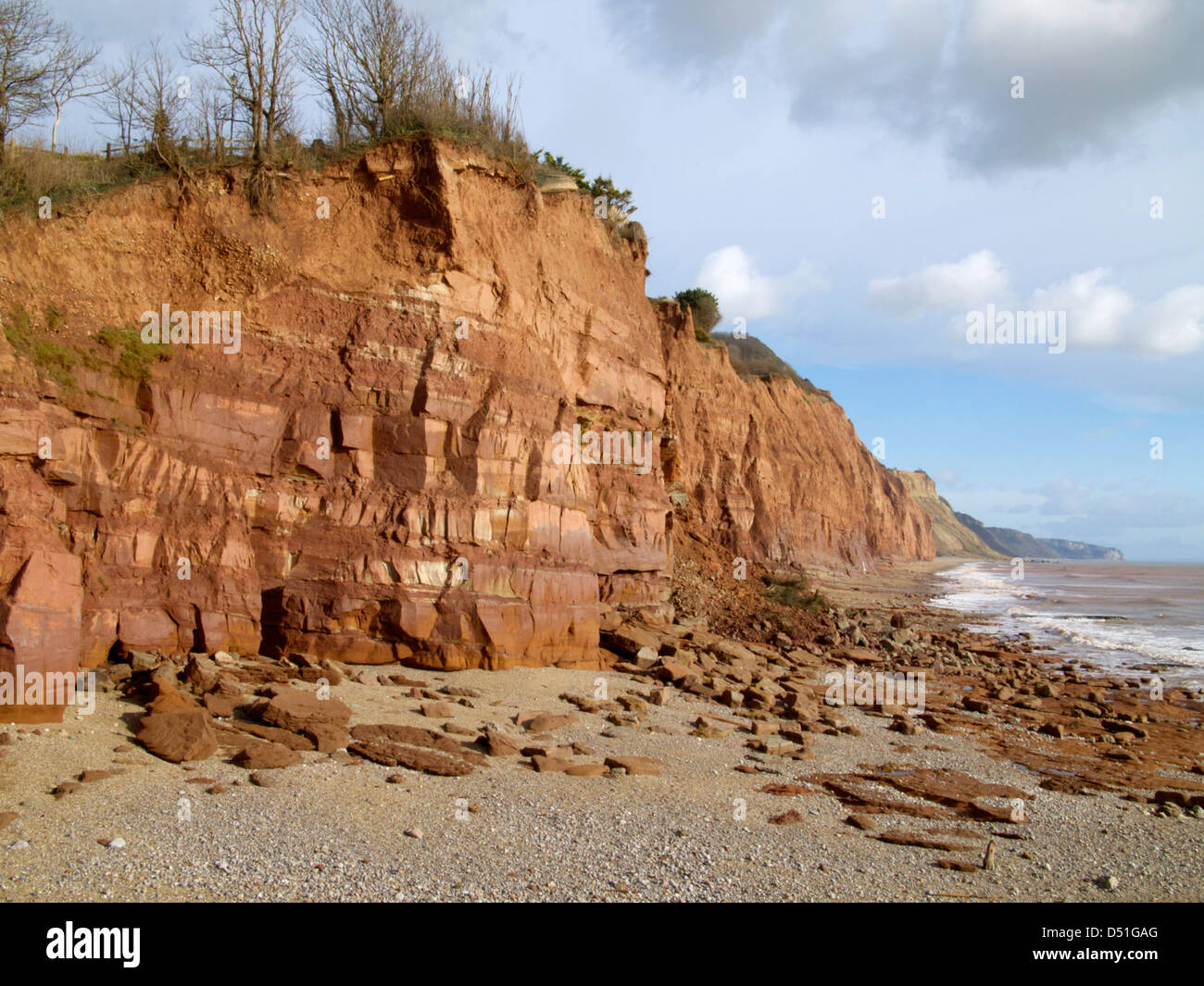 Red sandstone cliff face at Sidmouth Stock Photo - Alamy
