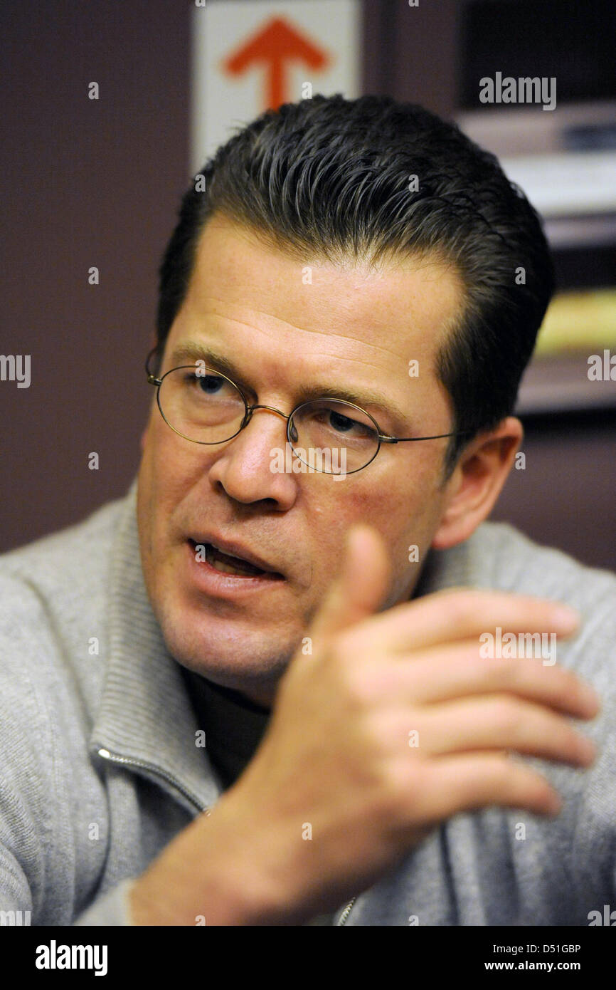 German Defence Minister Karl-Theodor zu Guttenberg talks to journalists ...