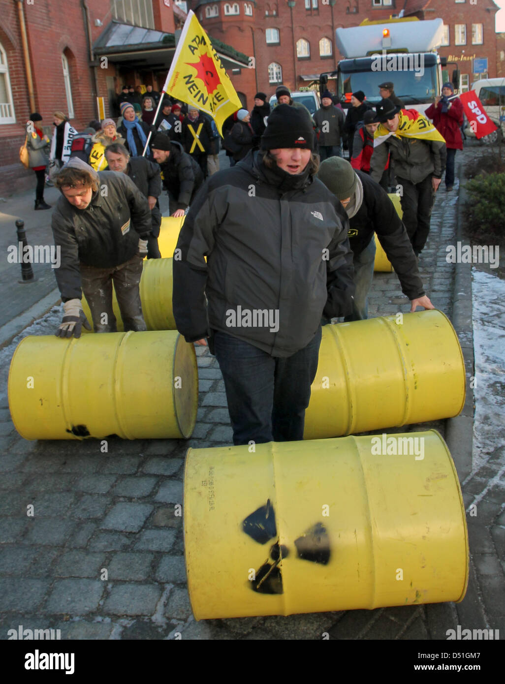 Anti-nuclear activists roll symbolic nuclear waste barrels to the ...