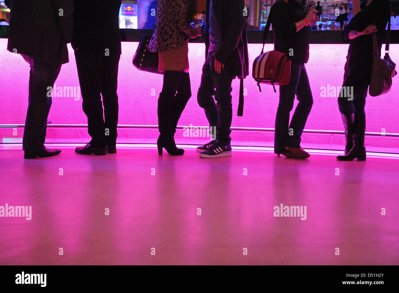 Guests stand at a bar of Cascade club in Berlin, Germany, 13 December ...