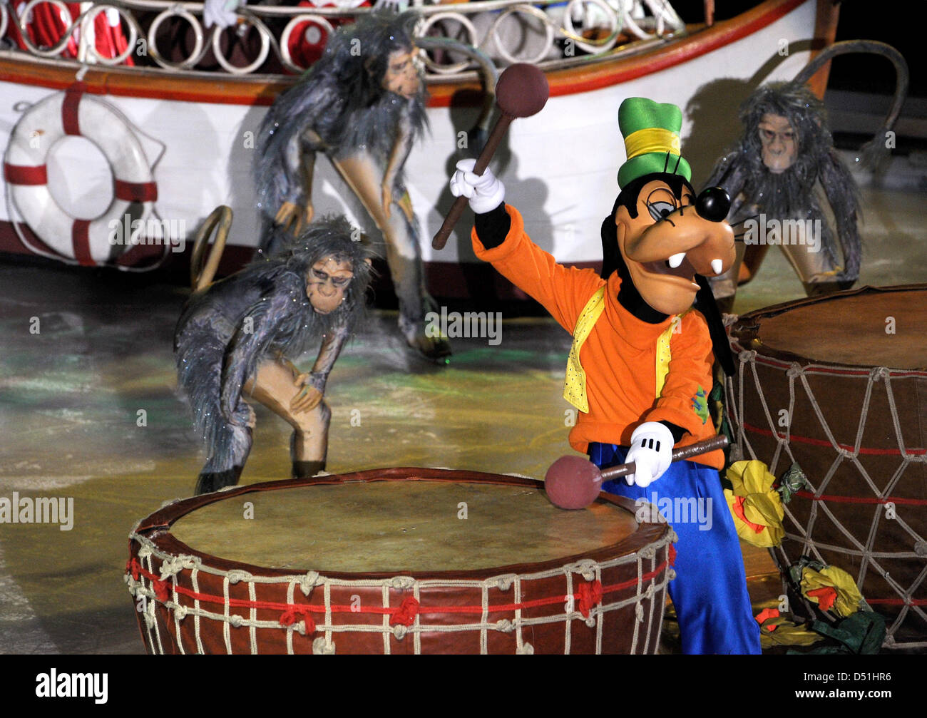 An ice scater dressed as Goofy dances across the ice at the Velodrom in ...