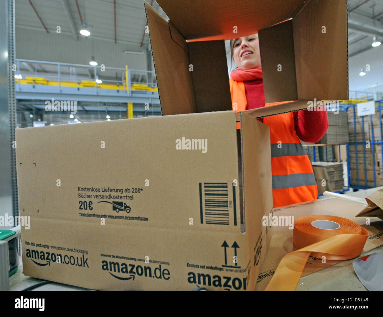 Parcels are packed at the logistics centre of Amazon in Leipzig ...