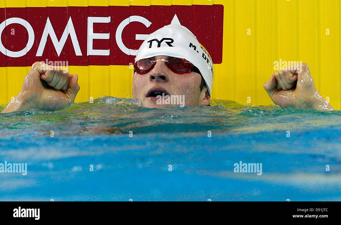 German swimmer Markus Deibler cheers after he achives second place for ...