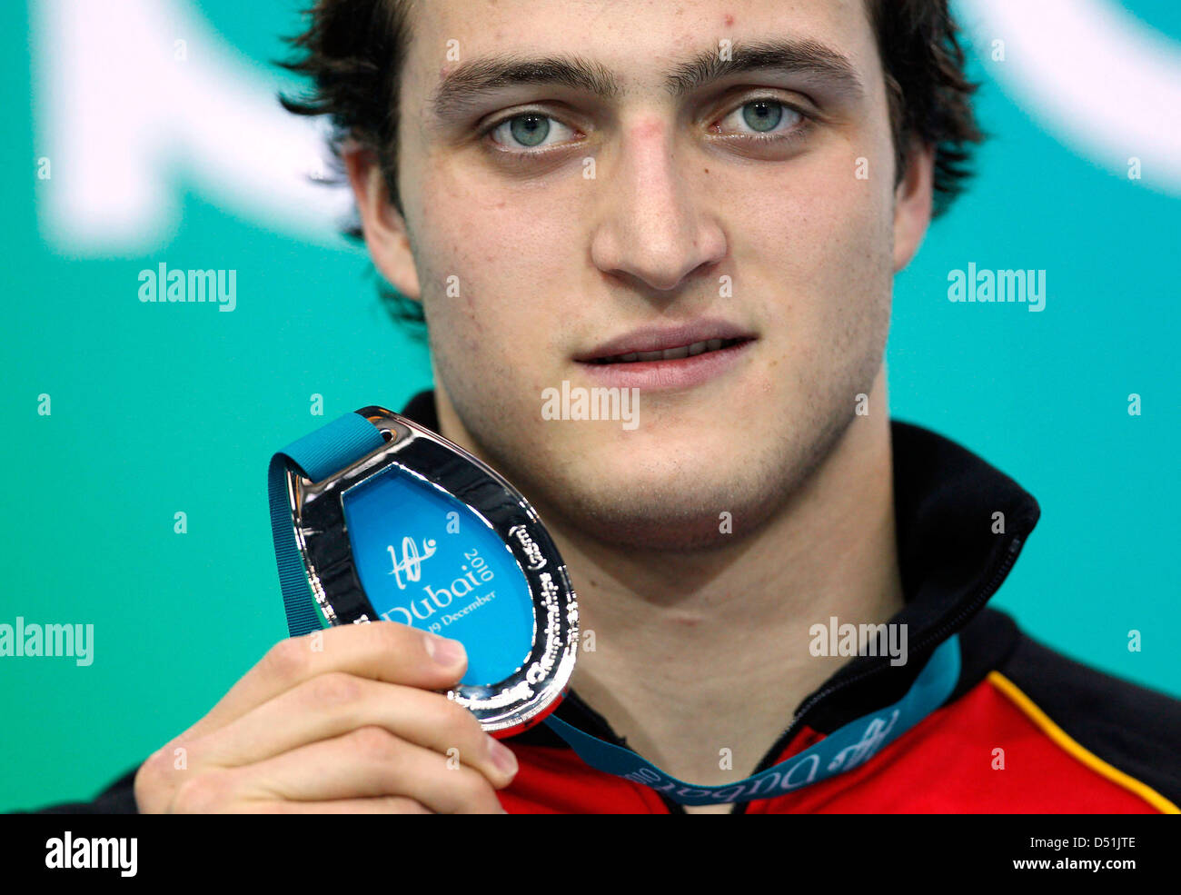 German swimmer Markus Deibler presents the silver medal for his 100m ...