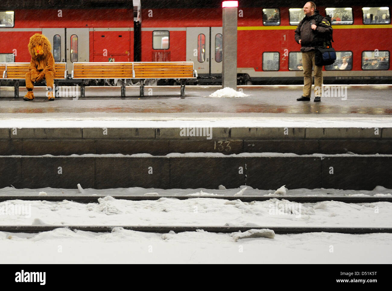A physics professor in a lion costume sits at the central station in ...