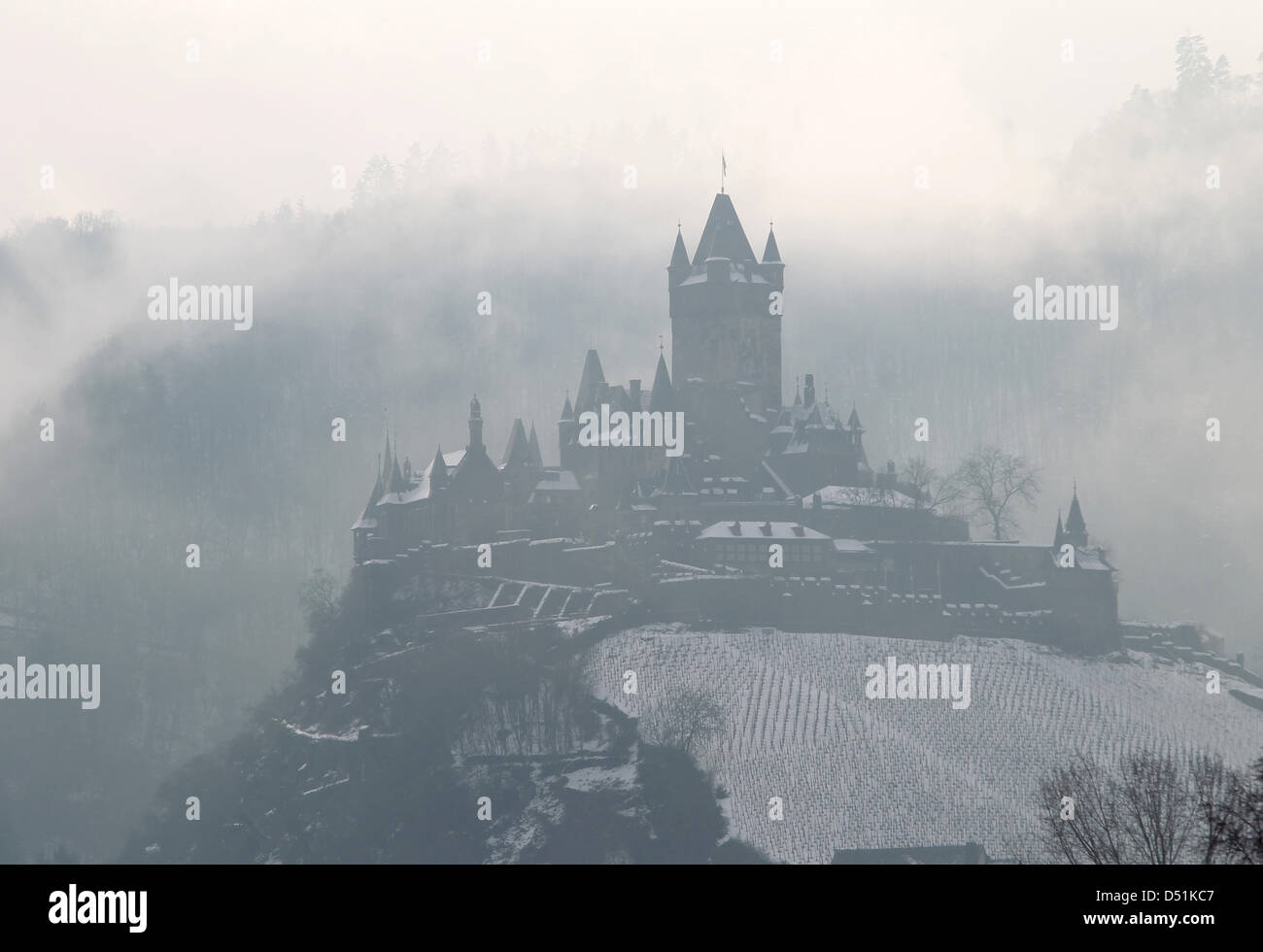 The Reichs castle is covered with snow and fog in Cochem, Germany, 10 ...