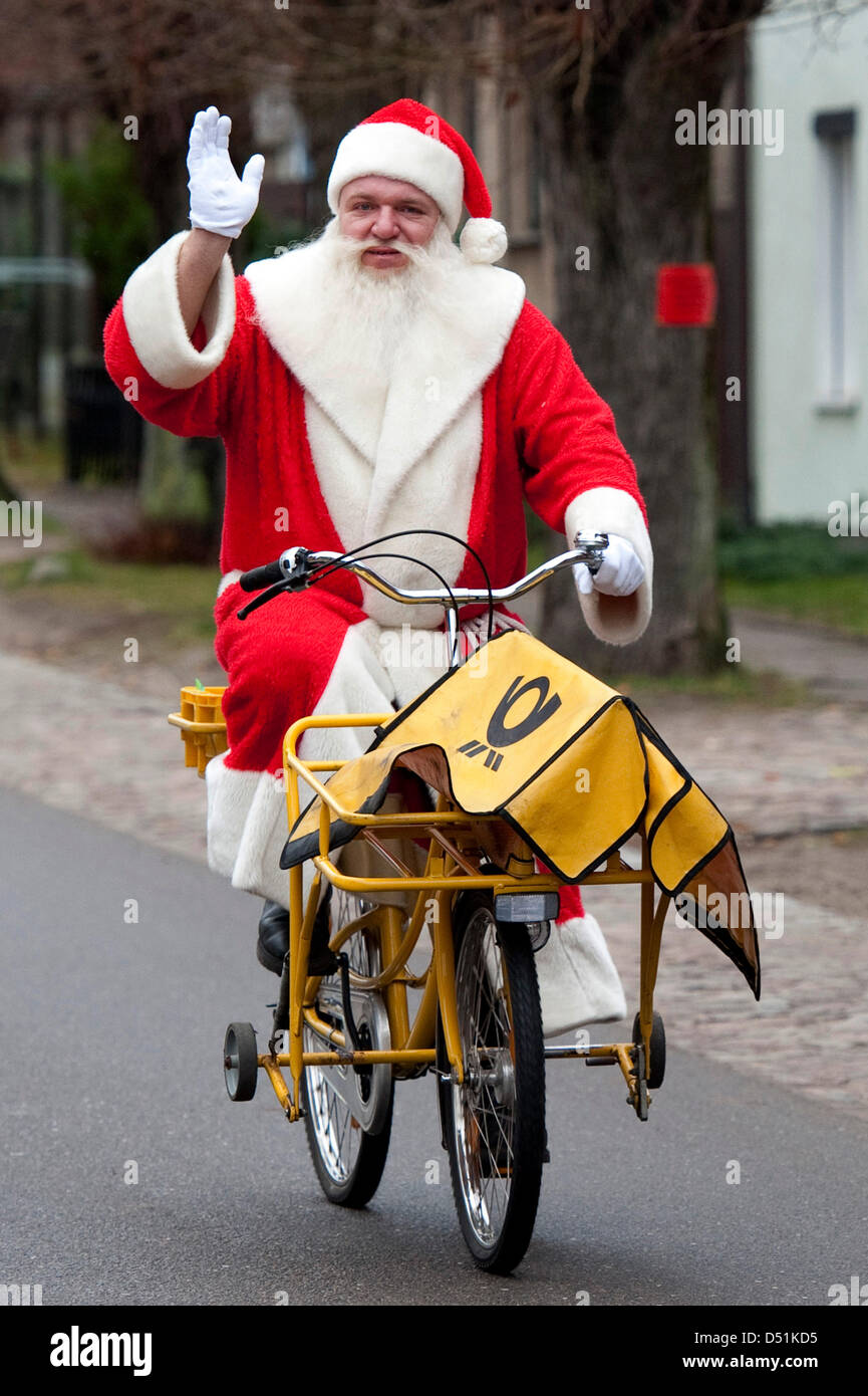 An employee dressed as Santa Claus of the Christmas postal service ...