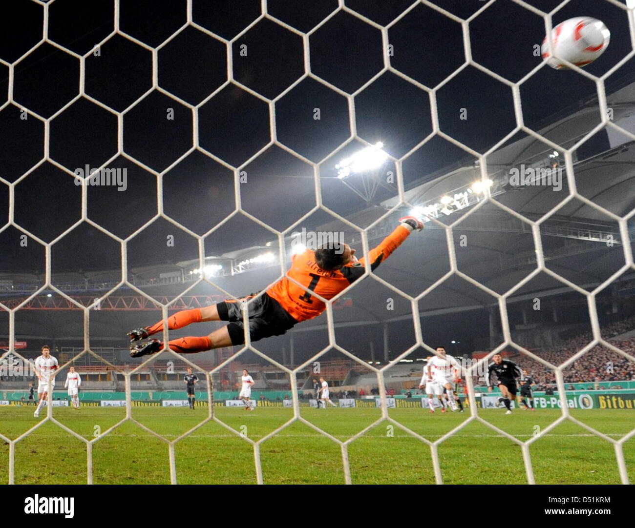 Stuttgart goalkeeper Sven Ulreich cannot reach Munich player Andreas ...