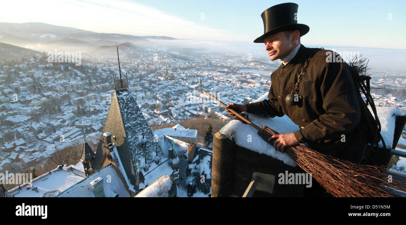 Chimney sweep Thomas Schramm checks a chimey on a roof of the Castle in ...