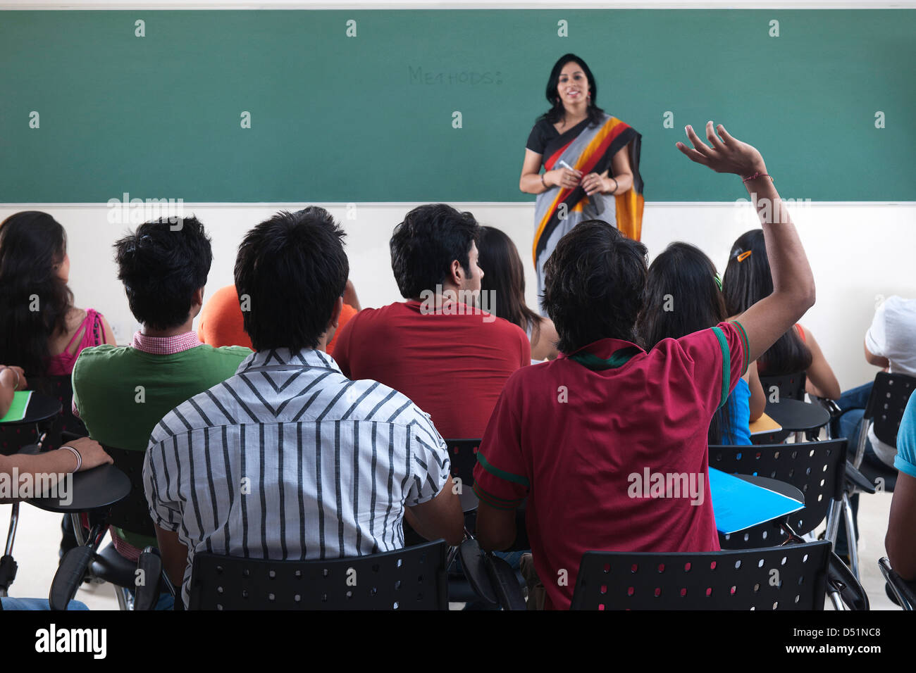 Female lecturer teaching in a classroom Stock Photo - Alamy