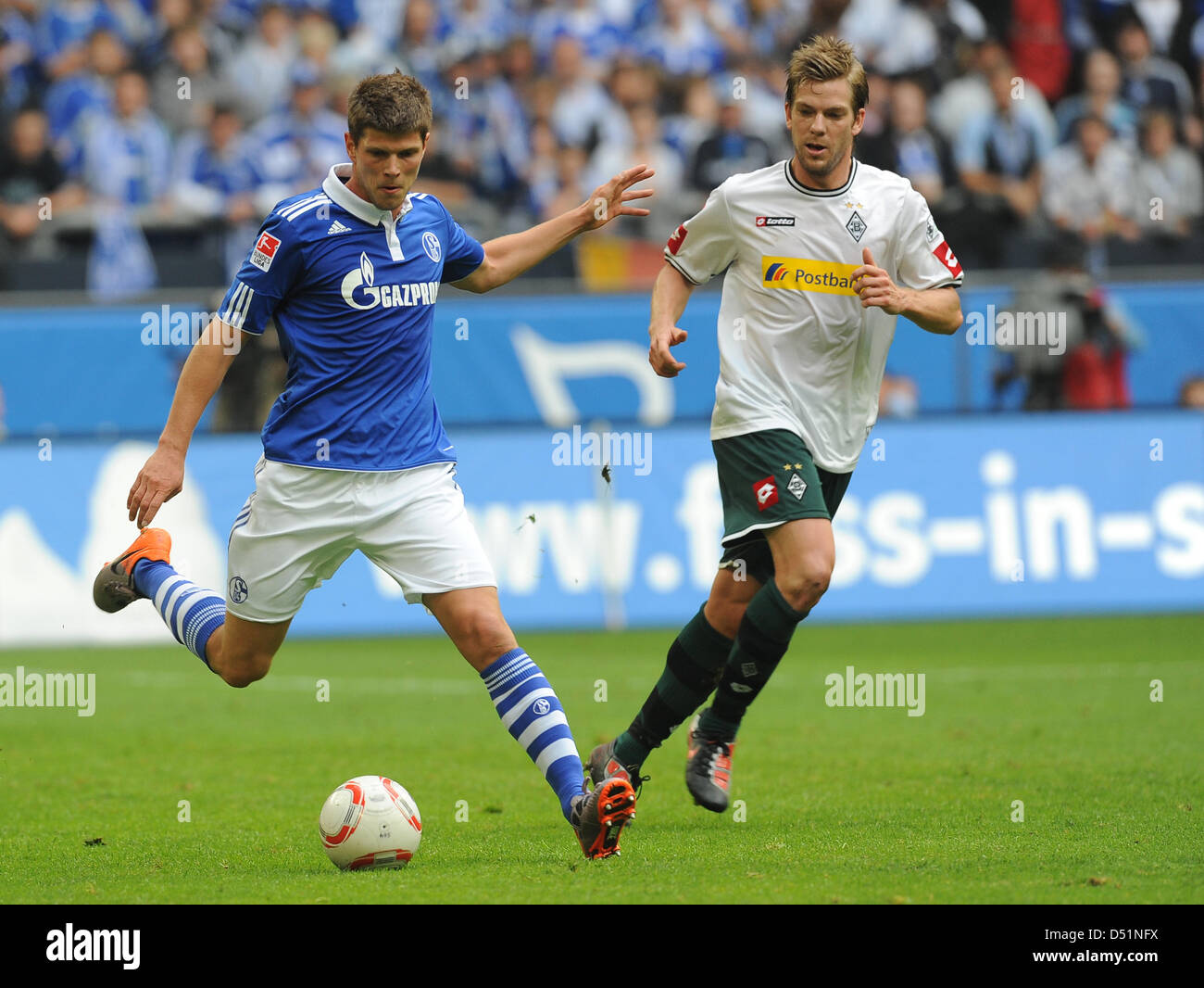 Schalke's Jan-Klaas Huntelaar tackles Thorben Marx from ...