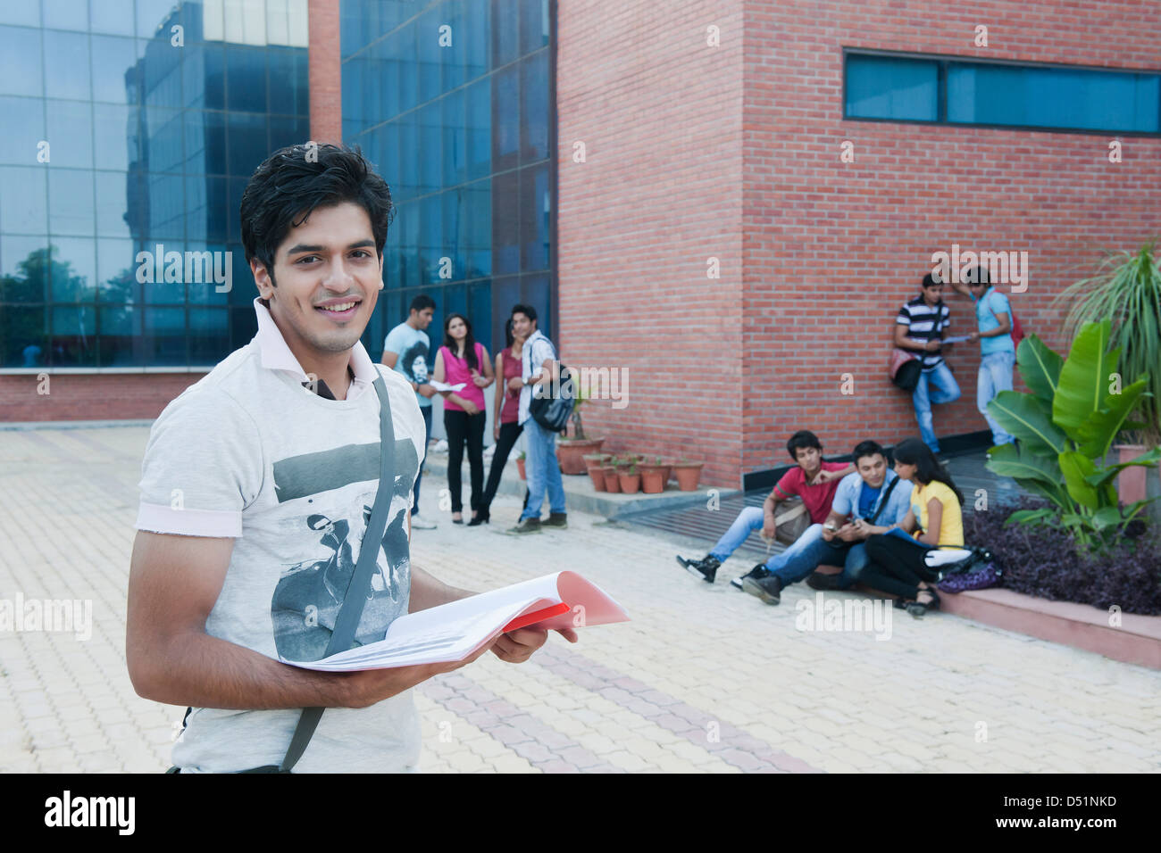Portrait of a college student smiling Stock Photo - Alamy