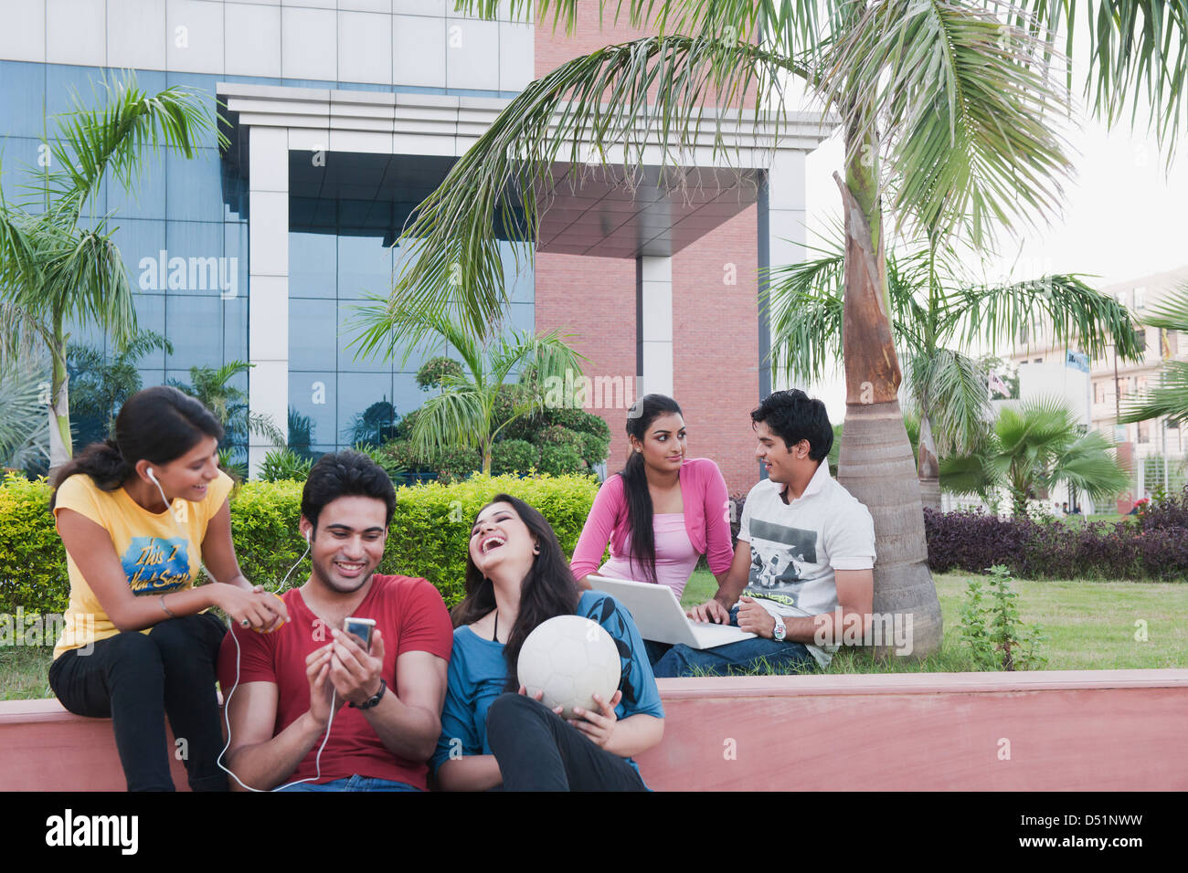 College friends enjoying at the university campus Stock Photo - Alamy