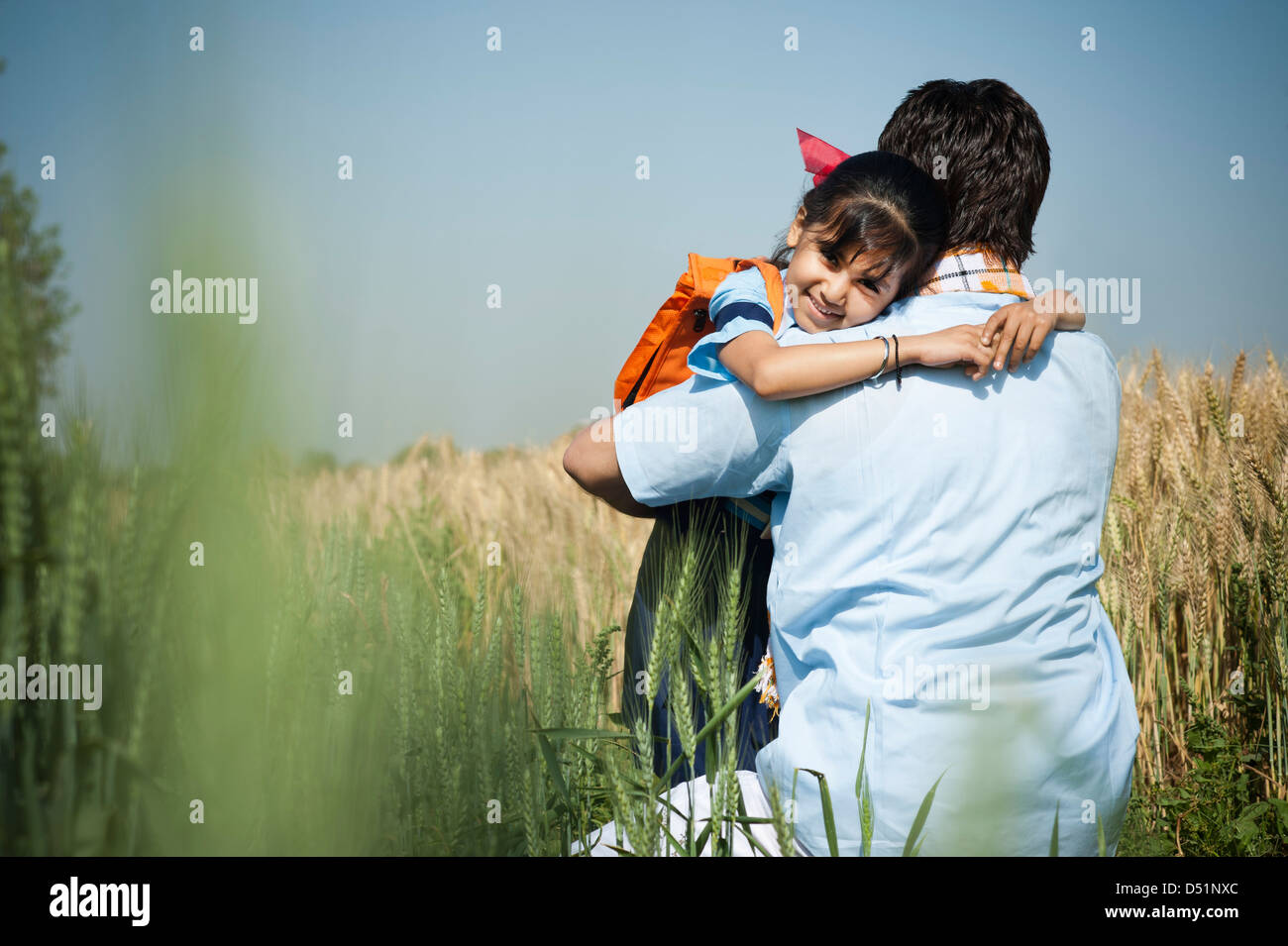 Farmer hugging daughter in field hi-res stock photography and images ...