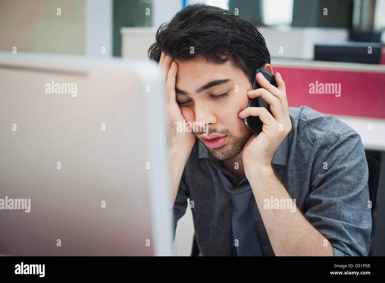 Tired businessman holding head listening hi-res stock photography and ...