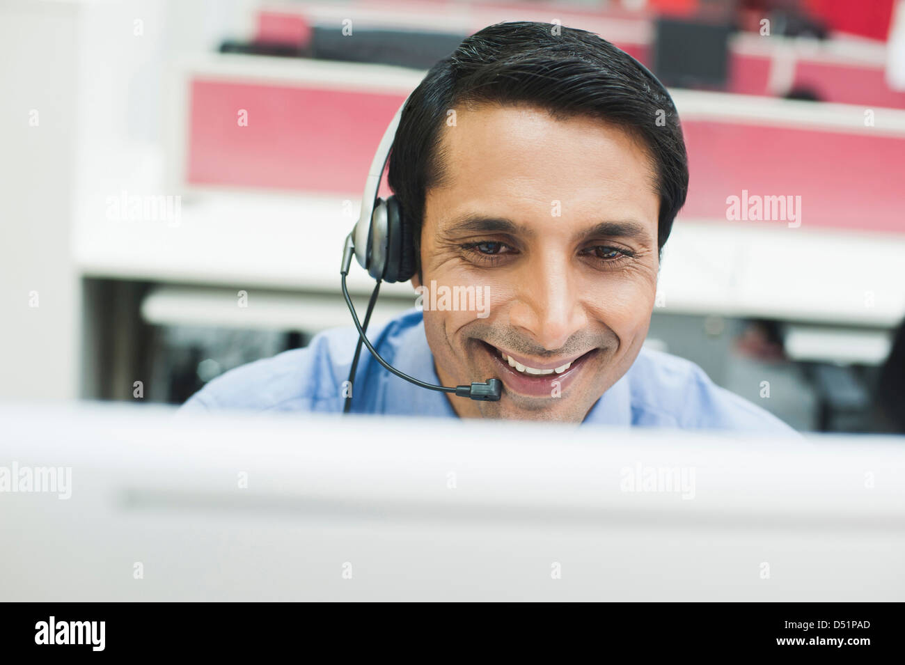 Customer service representative wearing a headset Stock Photo - Alamy