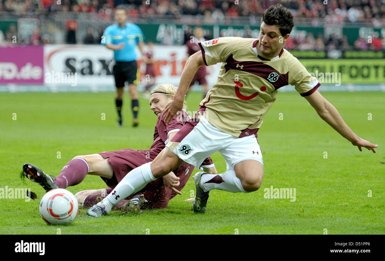 Kaiserslautern's Leon Jessen (L) and Hanover's Moritz Stoppelkamp (R) vie for the ball during ...