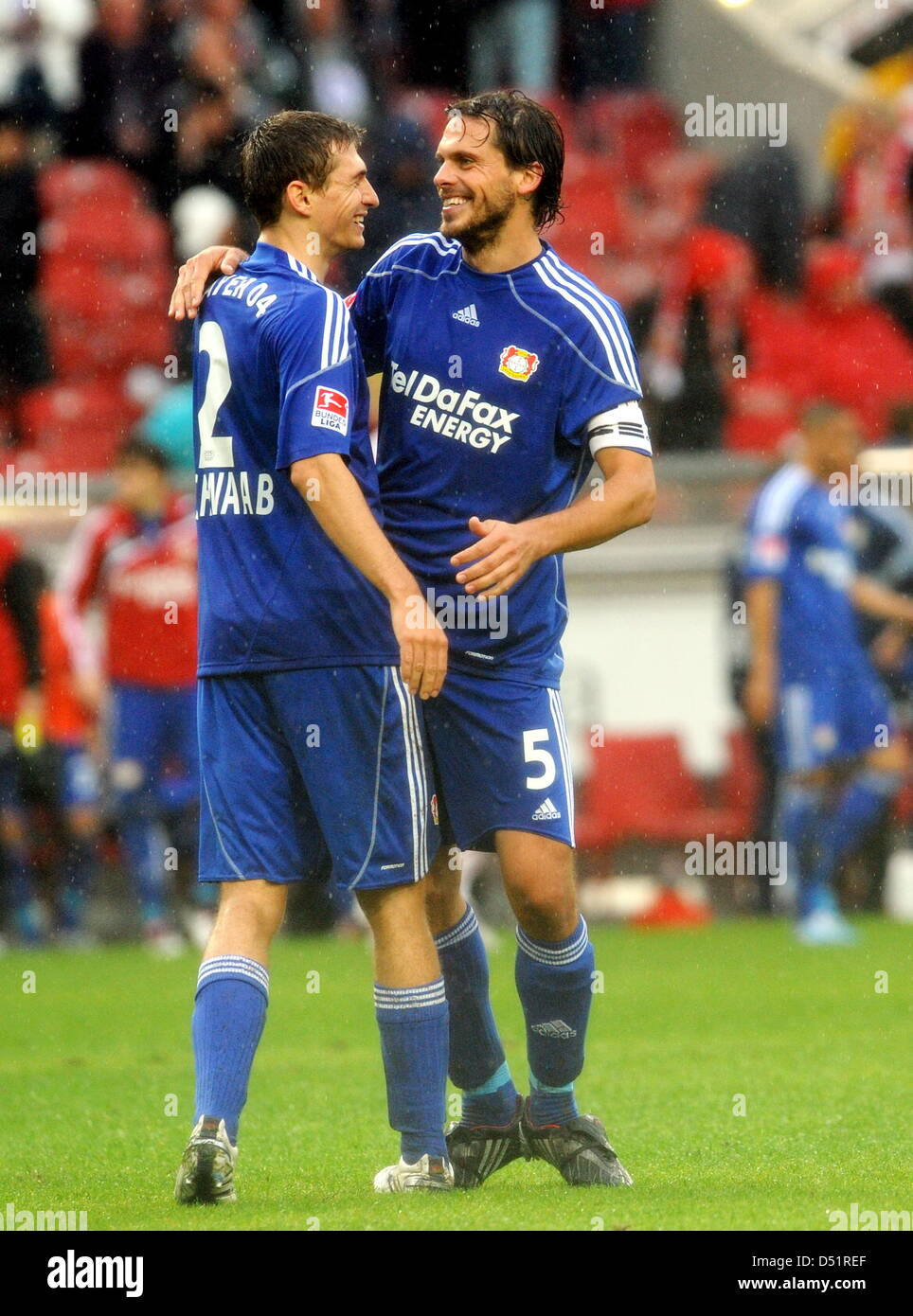 Leverskusen's Daniel Schwaab (L) and Manuel Friedrich (R) hug after ...
