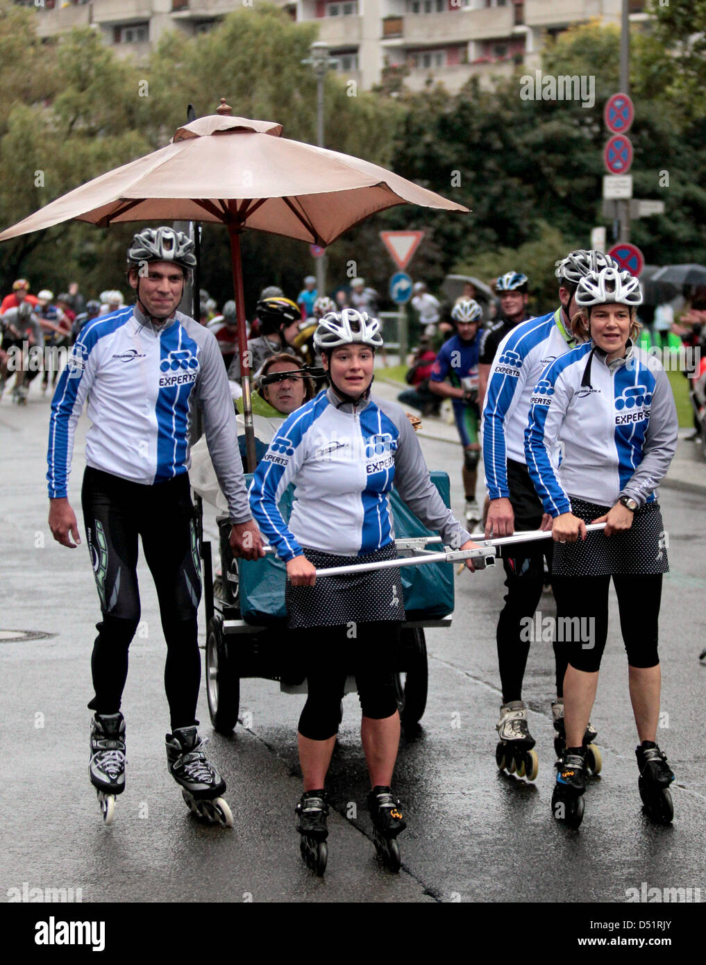 Participants in the Inline Skates Marathon ride through rainy Berlin ...
