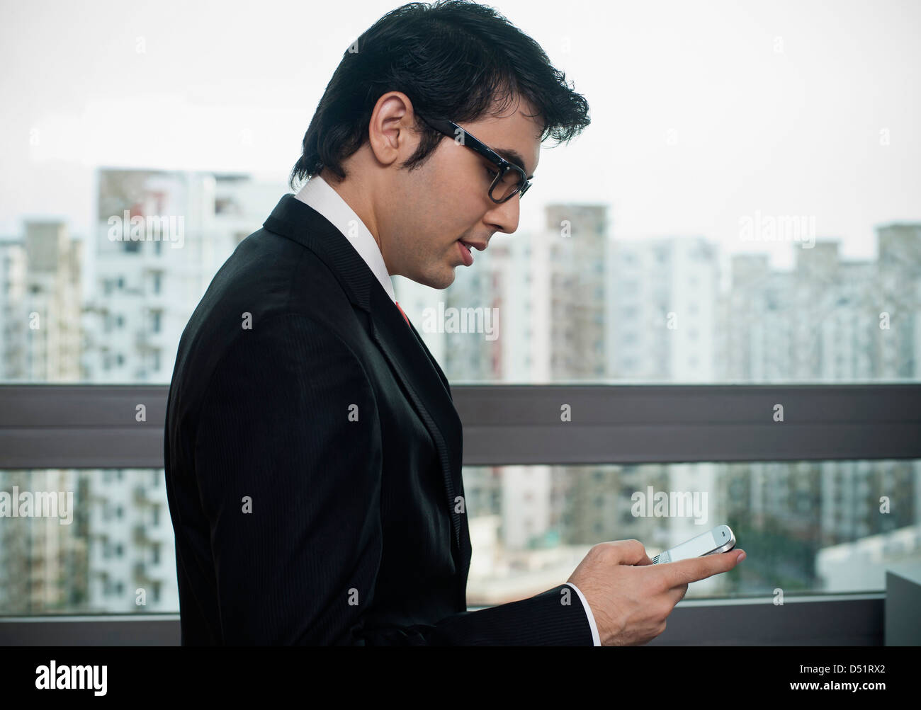 Businessman using a mobile phone Stock Photo - Alamy