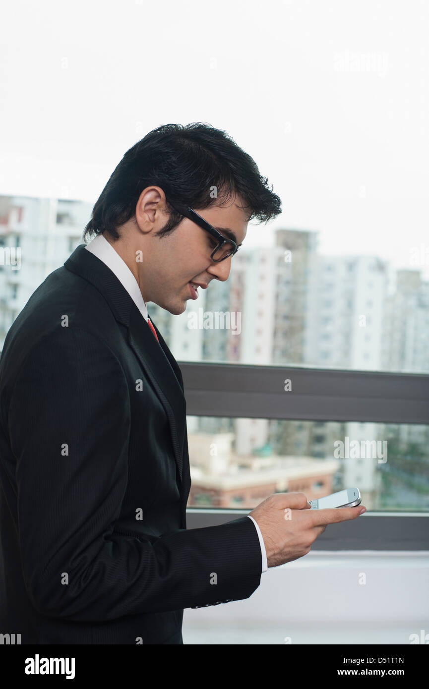 Businessman using a mobile phone Stock Photo - Alamy