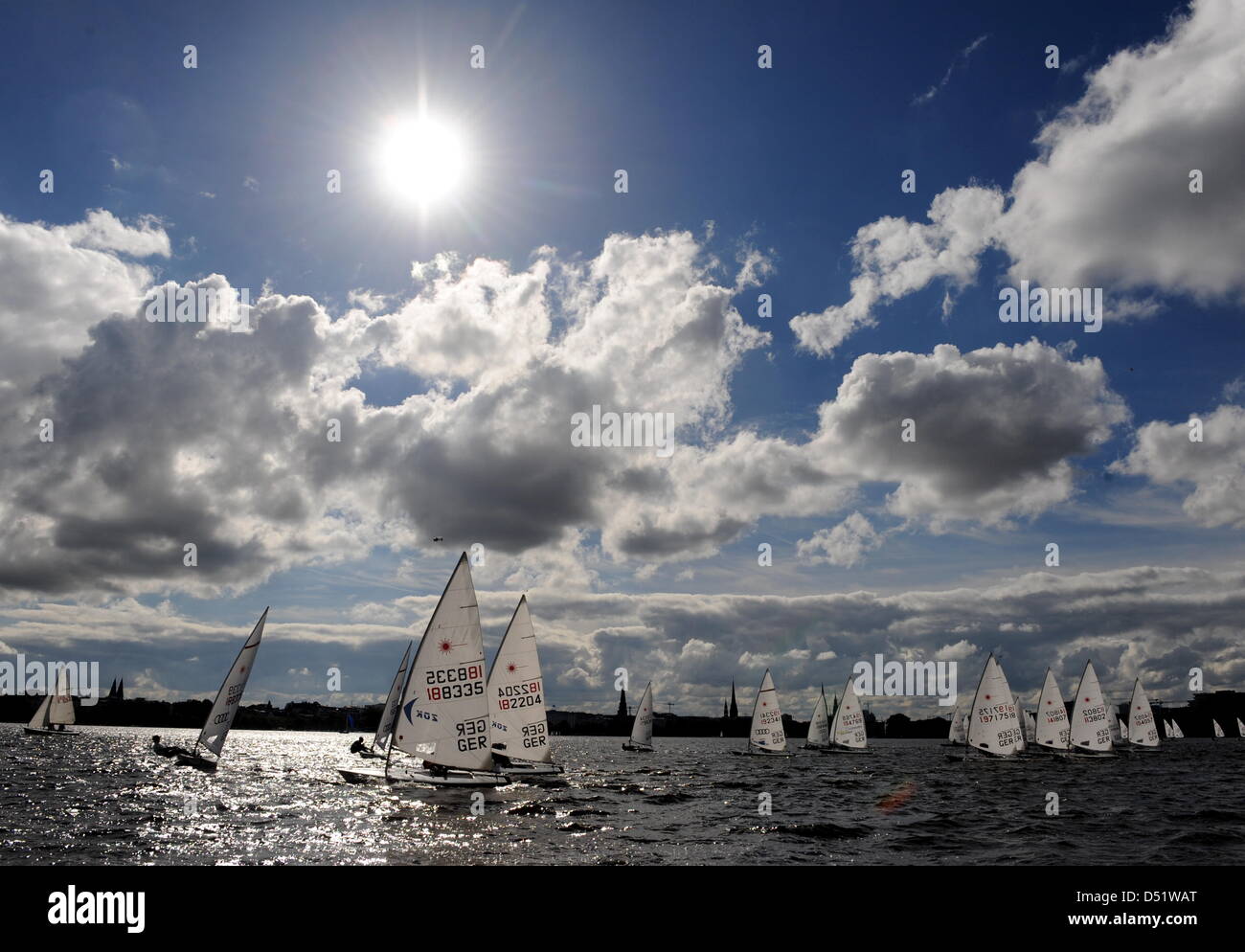 Laser class sailing boats during a regatta on Aussenalster river in ...